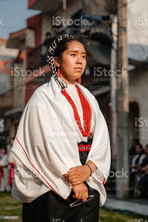 Local Mexican Girl In Traditional Outfits In The Street At The Annual