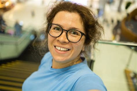 Video Call Portrait Of Excited Cheerful Smiling Woman In Spectacles
