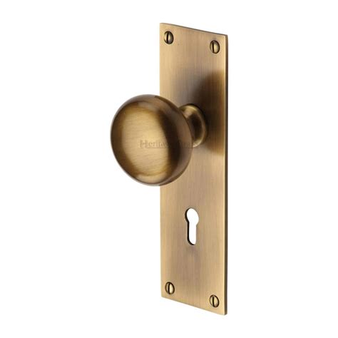 Heritage Brass Mortice Knob On Lock Plate Balmoral Design Antique Brass Finish Handles At Heart
