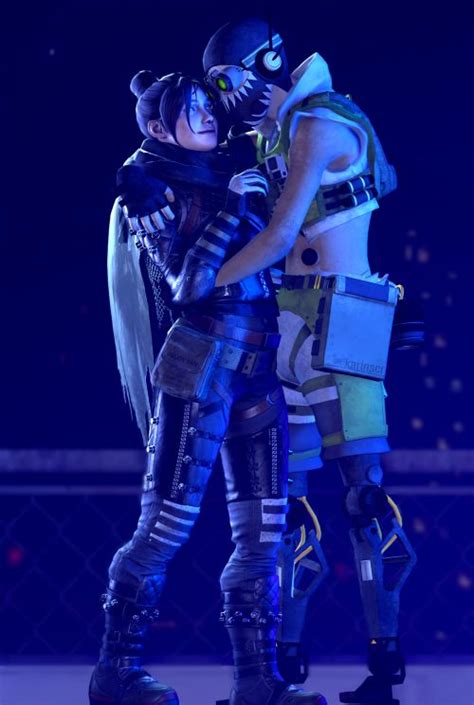 Two People In Costumes Standing Next To Each Other With Their Arms