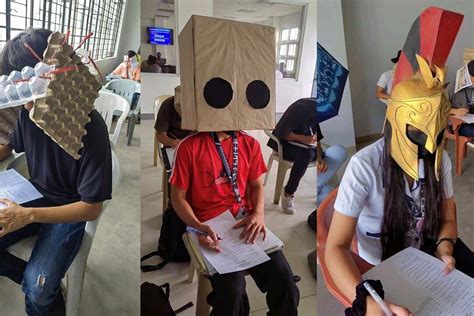 University Students In Philippines Wear Imaginative Hats To Avoid