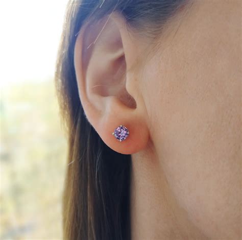 Сережки пусети зі срібла з фіолетовим фіанітом Dadiverin Jewelry