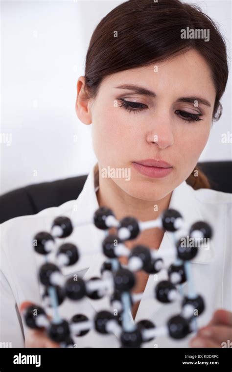Female Scientist Concentrating On Molecular Structure In Laboratory