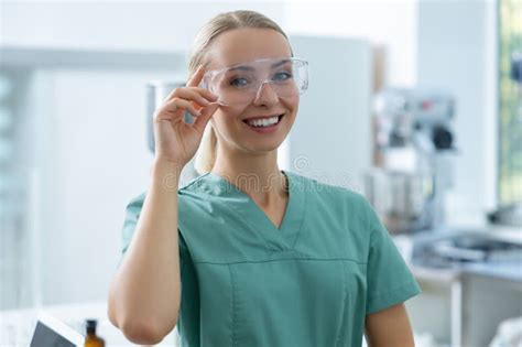 Adult Female Chemist Standing In Hospital Lab Conducting Biology Research Indoors Stock Image