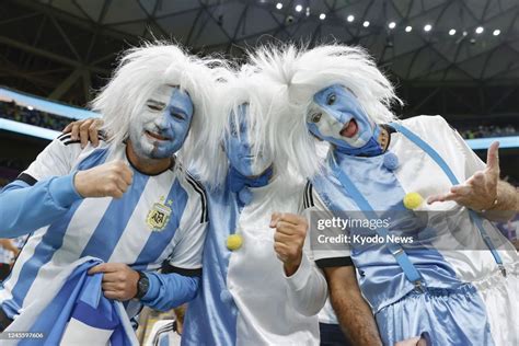 Fans With Their Faces Painted In The Colors Of The Argentinian Flag