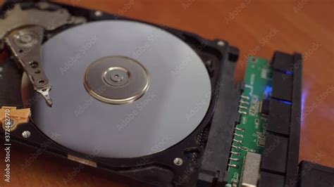 The Hard Disk Is Lying On The Table Blinking And Spinning The Disk Work Of A Hacked Hard Drive