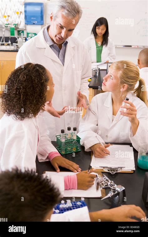 Babes In Physics Class With Teacher Stock Photo Alamy