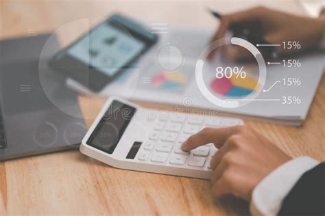 Small Entrepreneurs Calculating Figures In Company Financial Documents With A Calculator