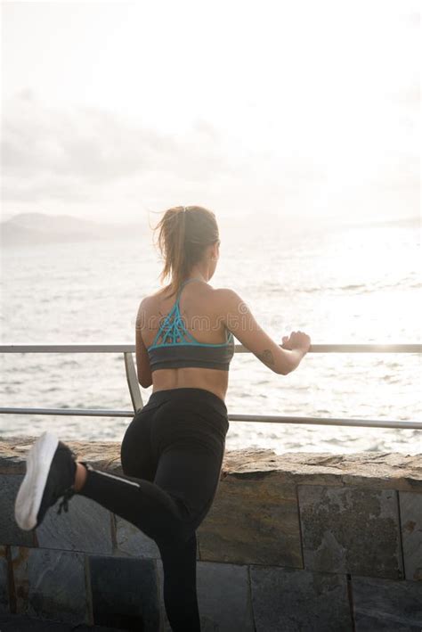 Fit Young Woman Holding Onto Railing Stock Image Image Of Sneakers