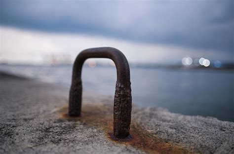 Premium Photo Rusty Hooks Of Ship Ropes At The Pier