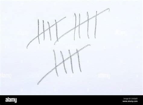 Counting Days By Drawing Sticks With Pencil On White Background