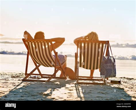 Couple Lounging On Beach