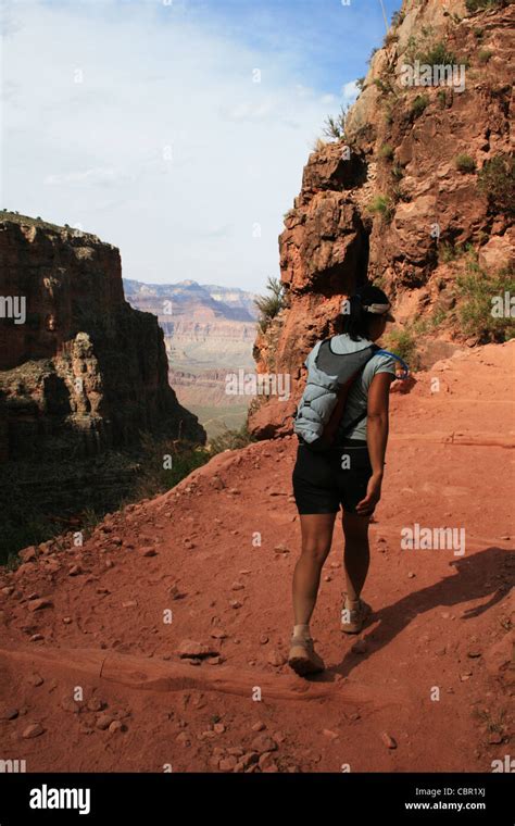A Woman Day Hiking On The Bright Angel Trail In The Grand Canyon