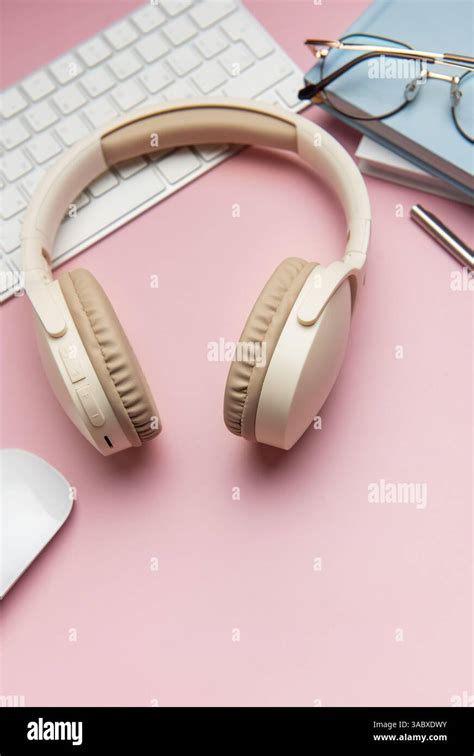 Modern Workspace With Wireless Headphones Keyboard Computer Mouse Eyeglasses Pen And