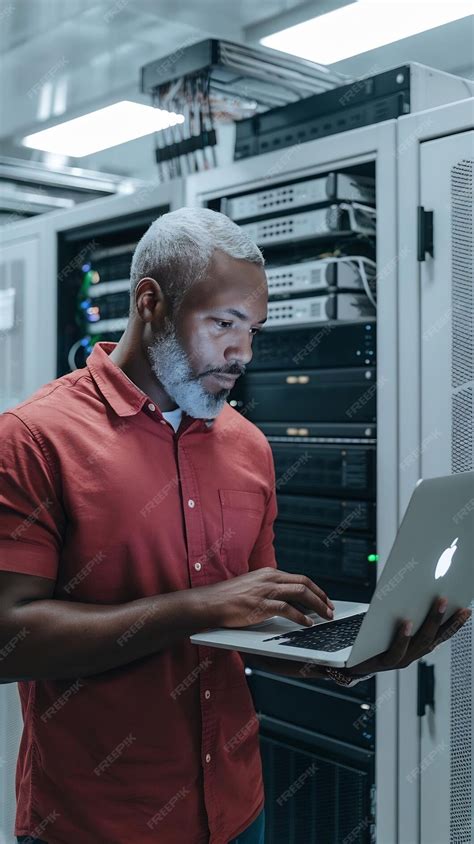 Laptop Server Room And Black Man On Network For Maintenance Programming
