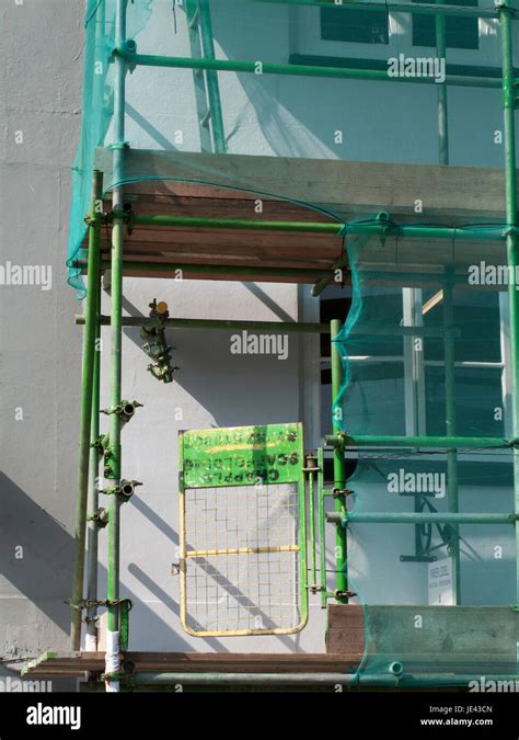 Scaffolding Access Gate To Residential Building Undergoing Renovation Work Stock Photo Alamy