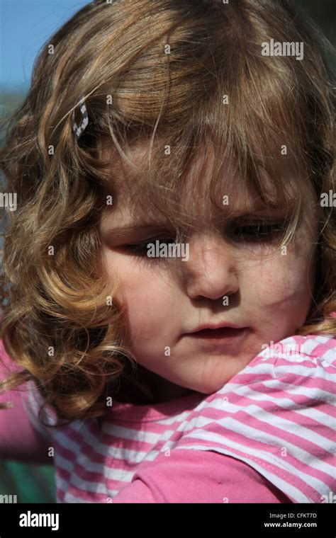Pretty Young British Girl With Curly Hair Aged Three Years Old Playing