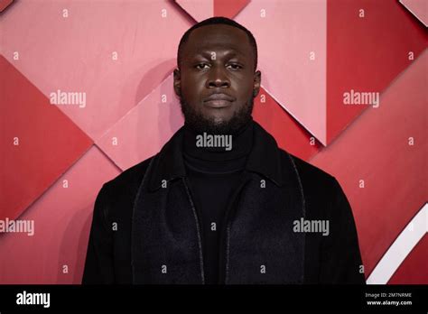Michael Ebenezer Kwadjo Omari Owuo Jr Known Professionally As Stormzy Poses For Photographers