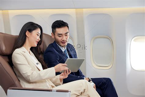 Business Man And Woman Discussing Work On The Plane Picture And HD Photos Free Download On Lovepik