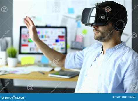 Young Male Software Programmer Testing A New App With 3d Virtual Reality Glasses In Office