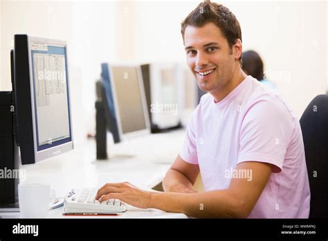 Man In Computer Room Smiling Stock Photo Alamy