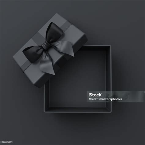 검은 리본이 달린 검은색 선물 상자와 그림자 최소한의 블랙 프라이데이 개념적 3d 렌더링으로 어두운 배경에 격리된 검은색 선물