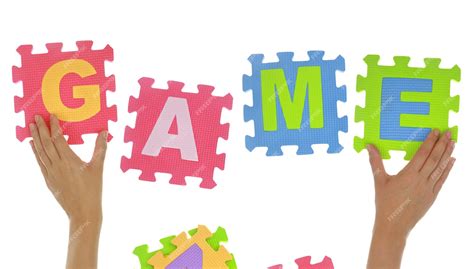 Premium Photo Hands Forming Word Game With Jigsaw Puzzle Pieces Isolated