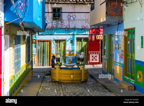 Fountain Among The Colorful Colonial Houses Of Guatape Colombia Stock
