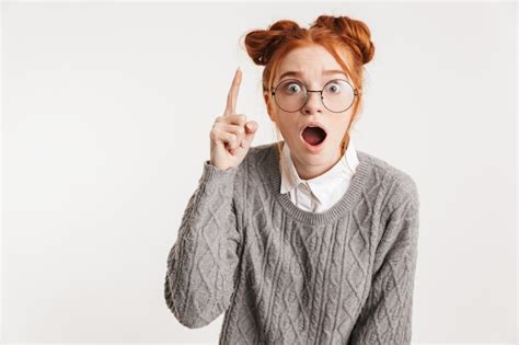 Premium Photo Portrait Of An Excited Young School Nerd Woman Pointing