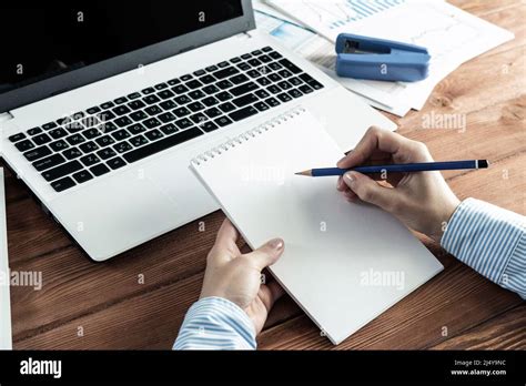 Woman With Notepad In The Office Stock Photo Alamy