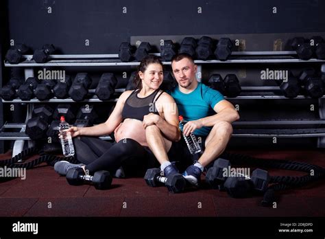 Pregnant Woman Goes For Sports With Her Husband In Gym For Cross