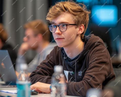 Premium Photo Young Programmer Focused On Coding Project During Team Hackathon Event