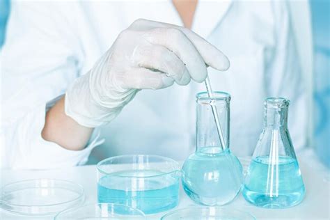 Premium Photo Scientific Workspace Assistant Manipulates Substances In The Lab Wearing Gloves