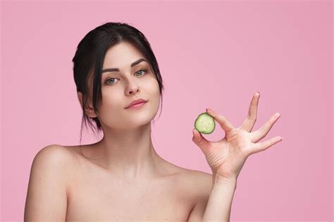 Premium Photo Female With Cucumber Slice In Studio