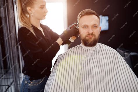 Premium Photo Pretty Barber Girl Cutting Hair
