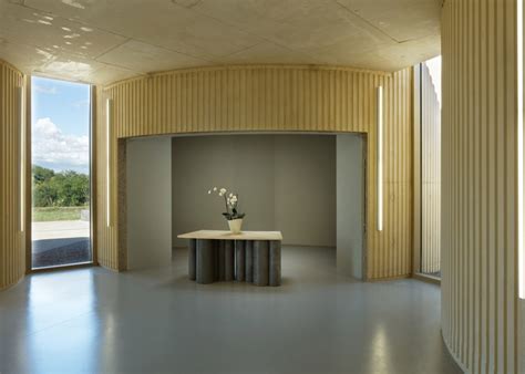 Plan 01s Crematorium Is Covered In Ribbed Concrete And Glass