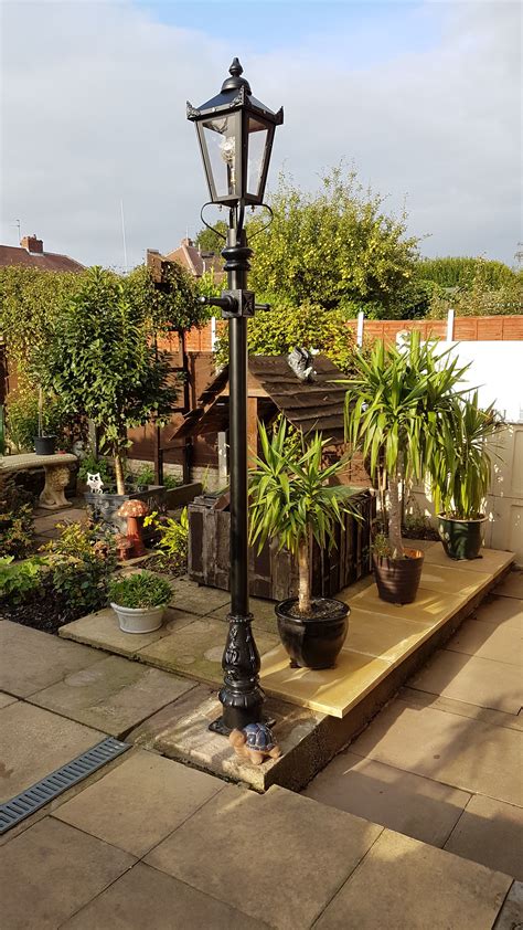 A 27 Metre Tall Black Victorian Lamp Post Installed On An Outdoor
