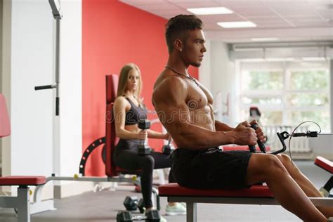 Guy Trains On Simulator And Girl Looks At Him Stock Photo Image Of Simulator Room