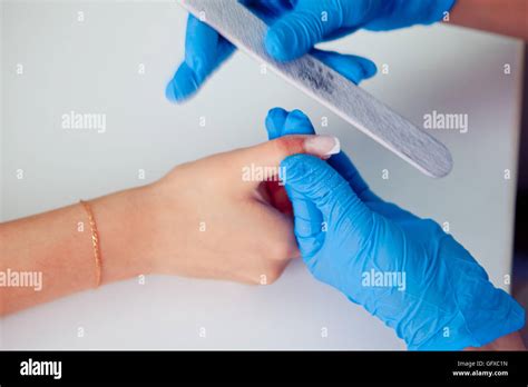 Woman With File Filing Nails Polishing Manicure Stock Photo Alamy