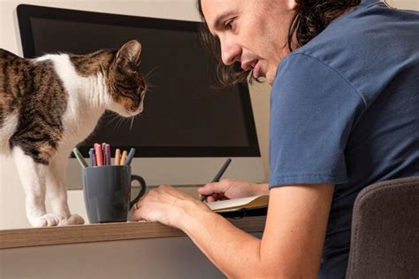 Premium Photo Man Writing In His Notebook