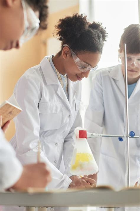 Teen Black Babegirl Wearing Lab Coat In Science Class Doing Experiments Stock Image Image Of