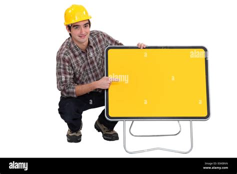 Man Pointing At Traffic Sign Stock Photo Alamy