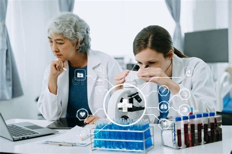 Scientist Team Meeting And Writing Analysis Results In The Laboratory