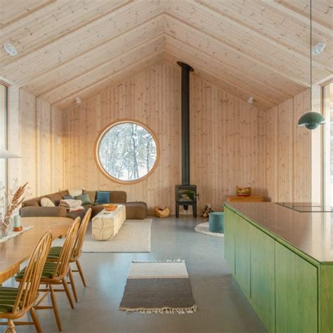 Quentin Desfarges Punctuates Woodland Cabin With Circular Windows