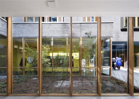 Michel Guthmann Pairs Grey Brick With Larch For Paris Housing Block