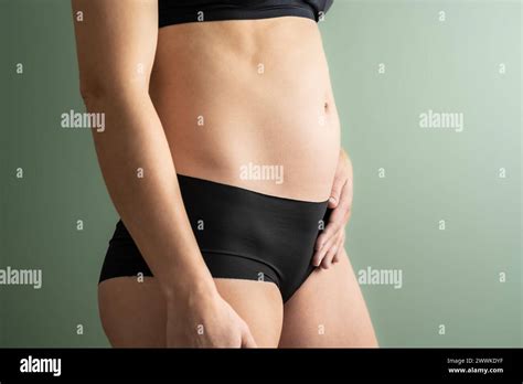 Description Midsection View Of An Unrecognizable Woman In The First