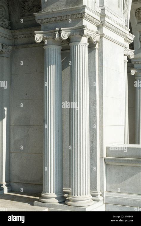 Pair Of Fluted Classical Columns At Entrance Of Monumental Building