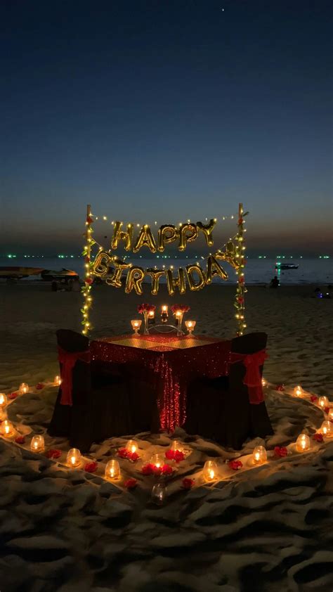 A Birthday Celebration Set Up On The Sand Of A Beach Shore · Free Stock