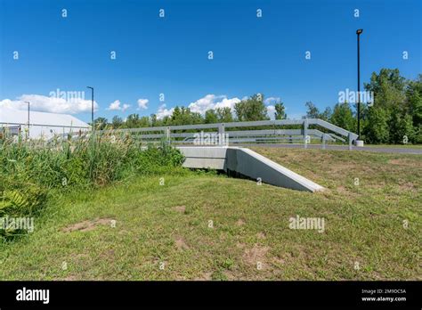 Three Sided Precast Concrete Bridge With Guide Rails Installed Over A