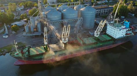 Grain Loading To Bulker Ship Cargo Container At Sea Grain Terminal In Grain Loading To Bulker Ship Cargo Container At Sea Grain Terminal In